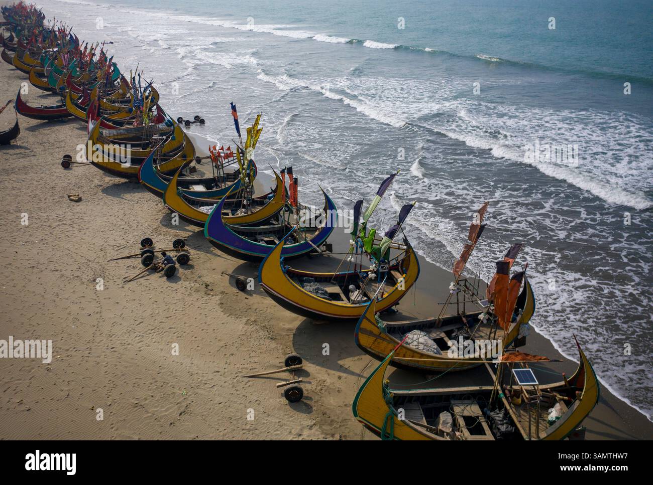 Aerial view of traditional fishing boats along the shoreline on the beach on St. Martin's Island ...