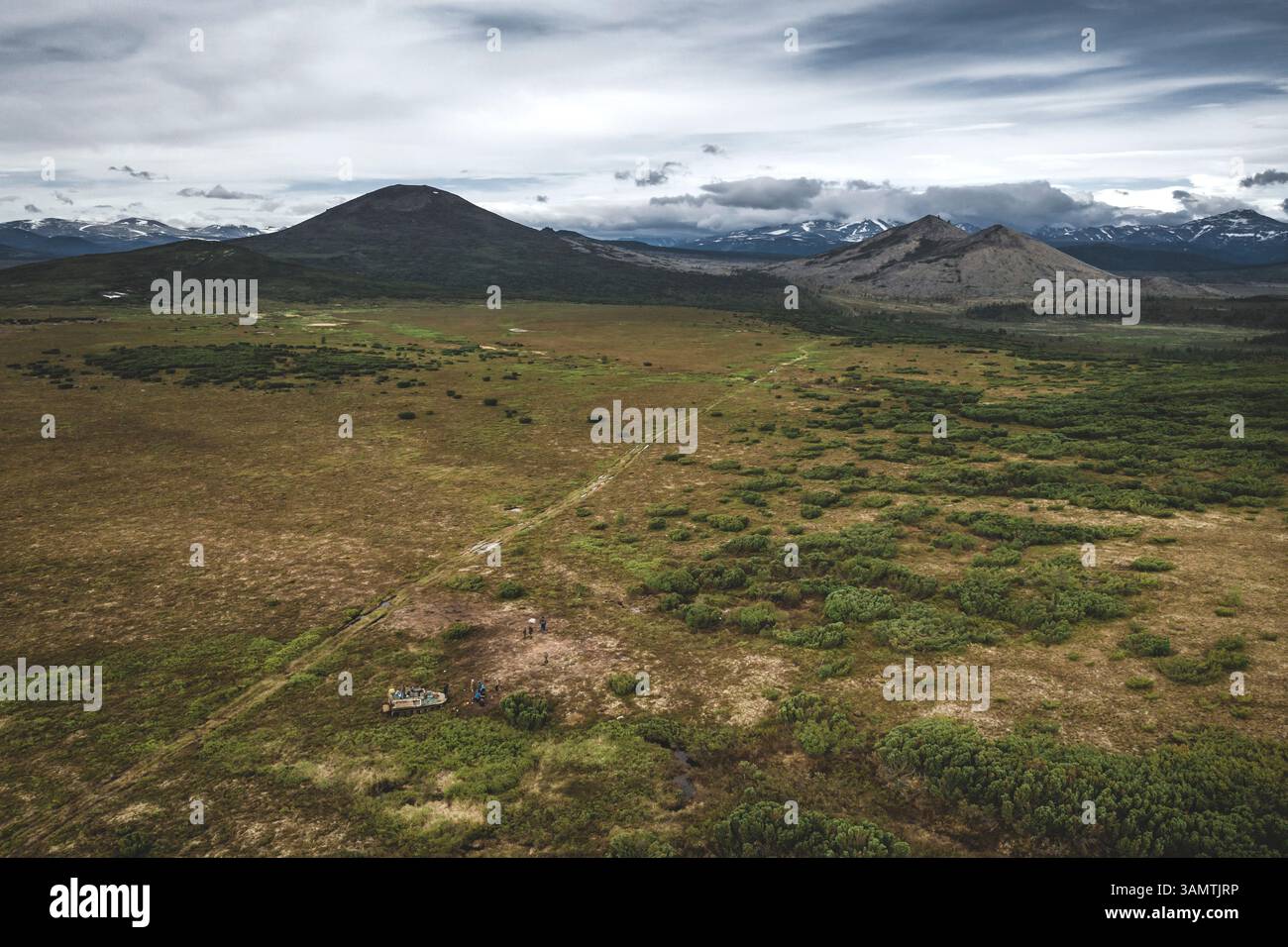 Aerial view of an all terrain vehicle in the process of crossing a wild ...