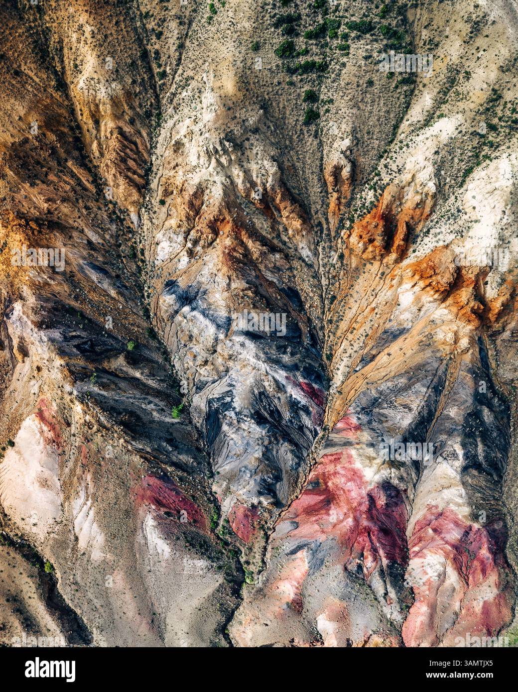 Aerial view of multicoloured textures of clay rocks coming to the ...