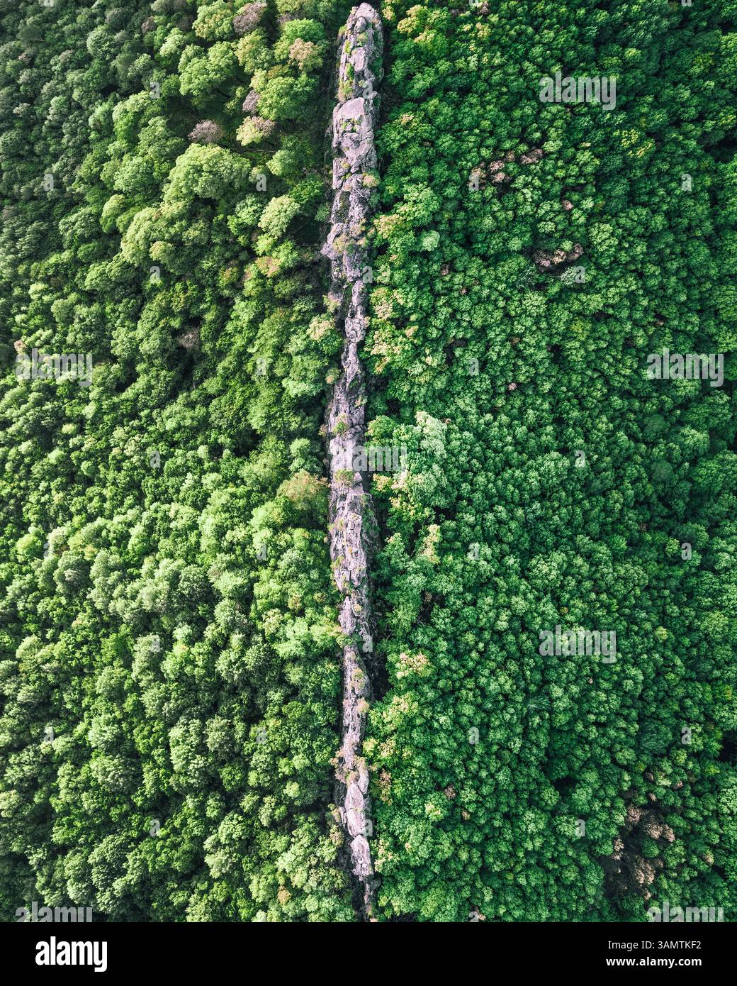 Aerial view of a narrow ridge of rocks with the little people on top in ...