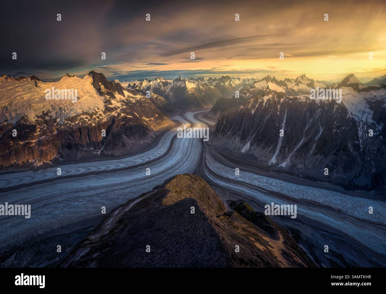 Aerial view of gilkey glacier at sunset surrounded by majestic ...