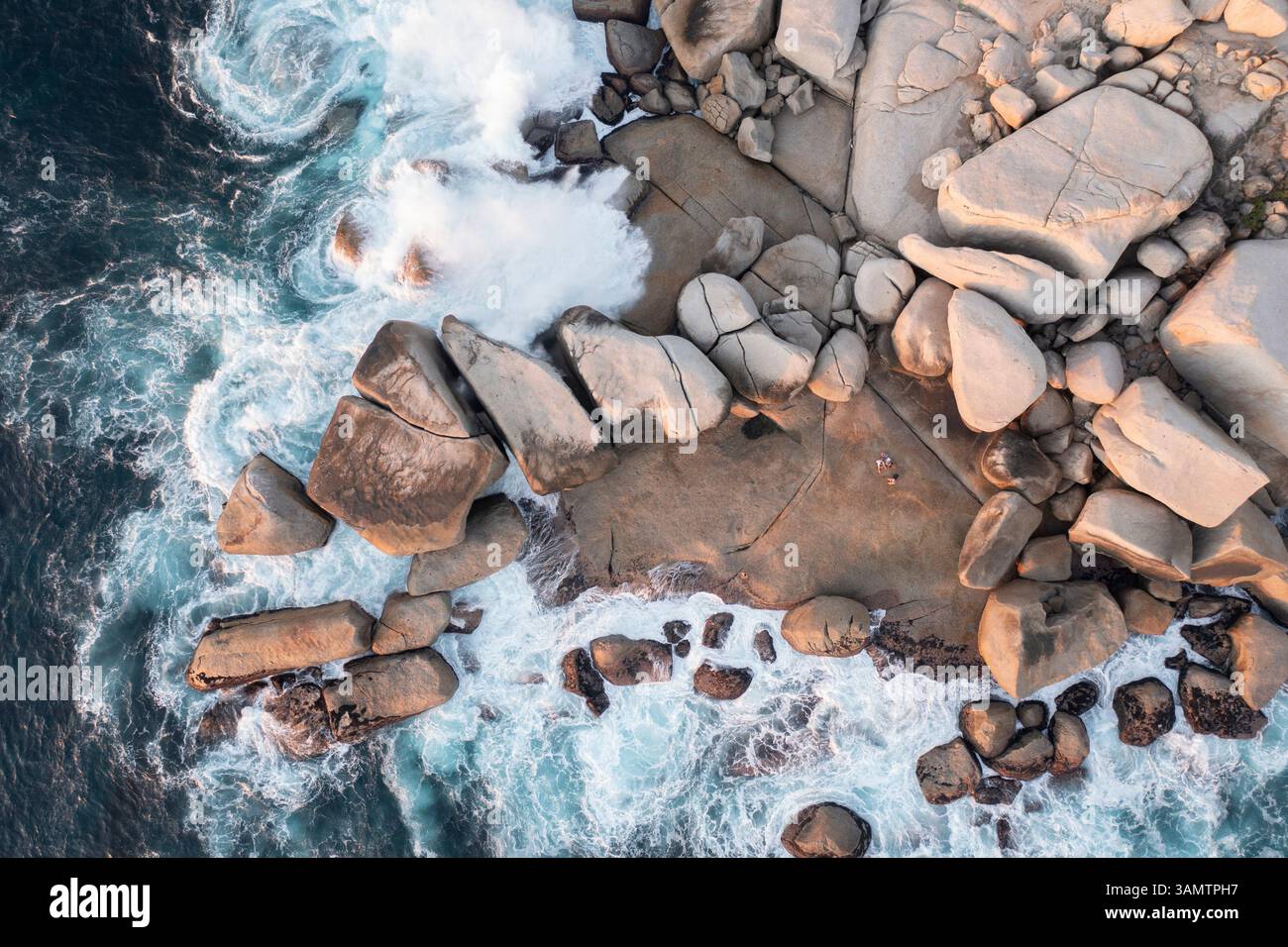 Aerial view of rocky shore and turquoise ocean, Llandudno, Hout Bay ...