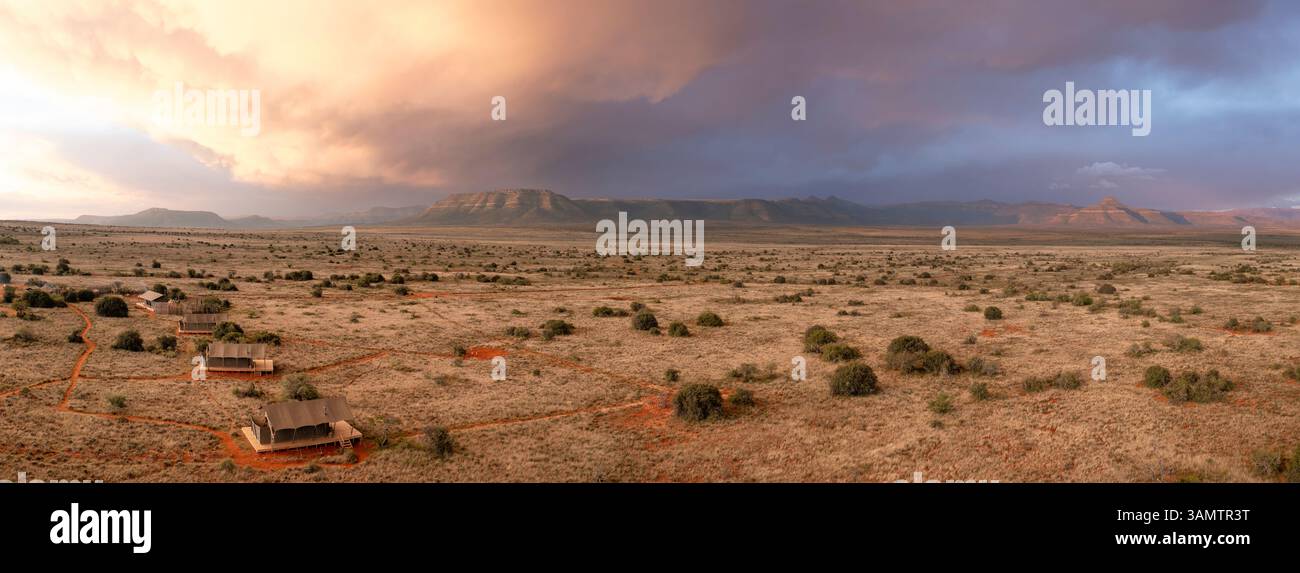 Aerial view of mountains, valley, sky, and cottages in Samara Karoo ...
