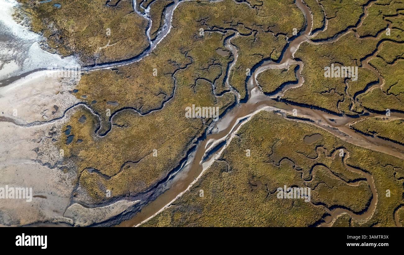 Aerial view of salt flats and serpentine river with beautiful wetlands ...