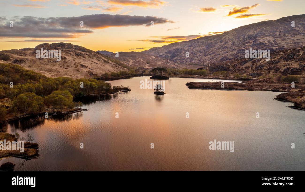 Aerial view of serene lake, mountains, and twilight reflection at Loch Eilt, Scotland Stock ...