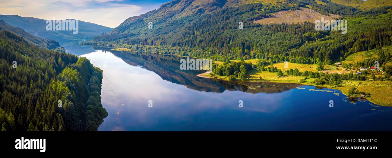 Aerial view of Loch Lubnaig surrounded by lush forests and majestic ...