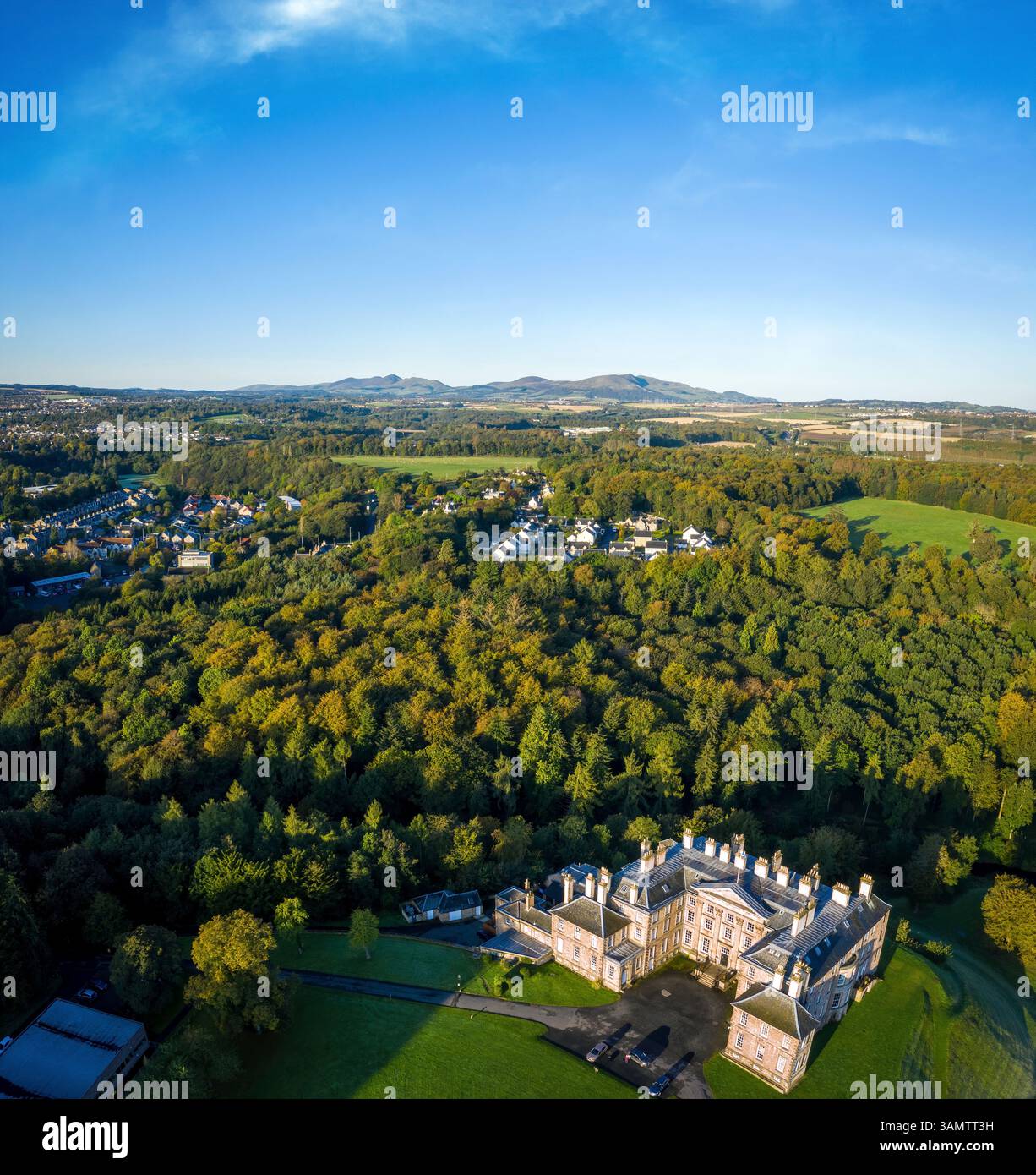 Aerial view of Dalkeith Country Park with castle, forest, mansion, and ...