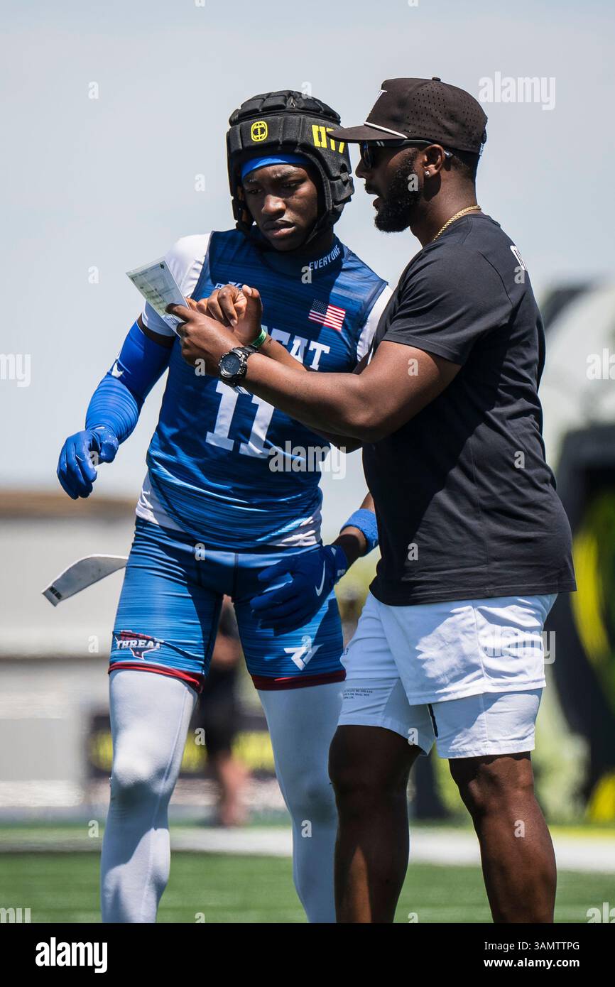 Texas Threat's DaQuwan Dunn talks with head coach Christian White ...