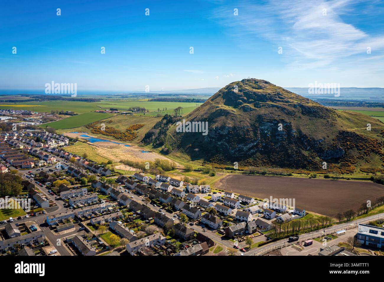 Aerial view of North Berwick Law with town and residential area ...