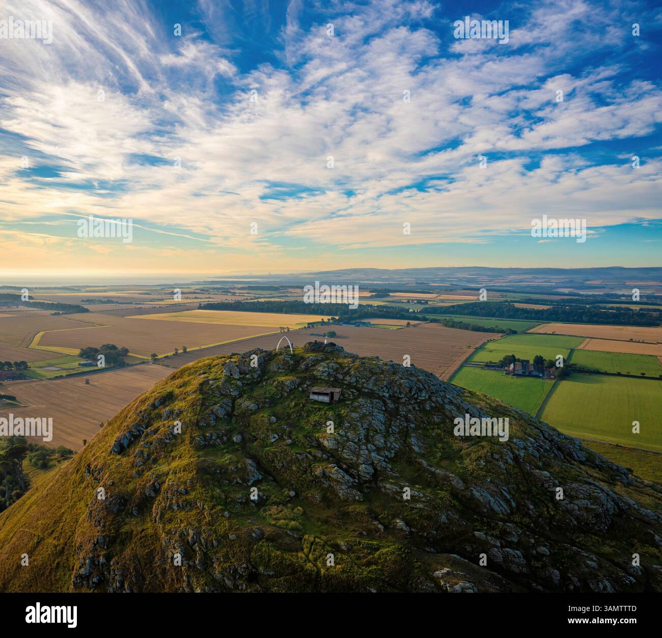 Aerial view of scenic North Berwick Law with rocky terrain and farmland ...