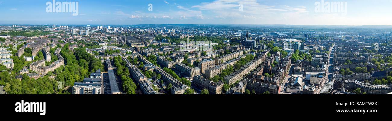 Aerial view of urban skyline with greenery and rooftops, Glasgow ...