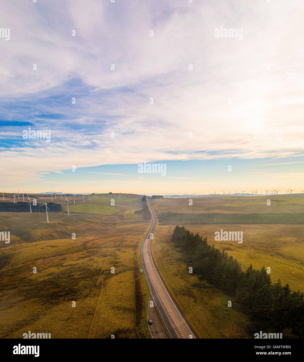 Aerial view of wind turbines along road with scenic countryside and ...