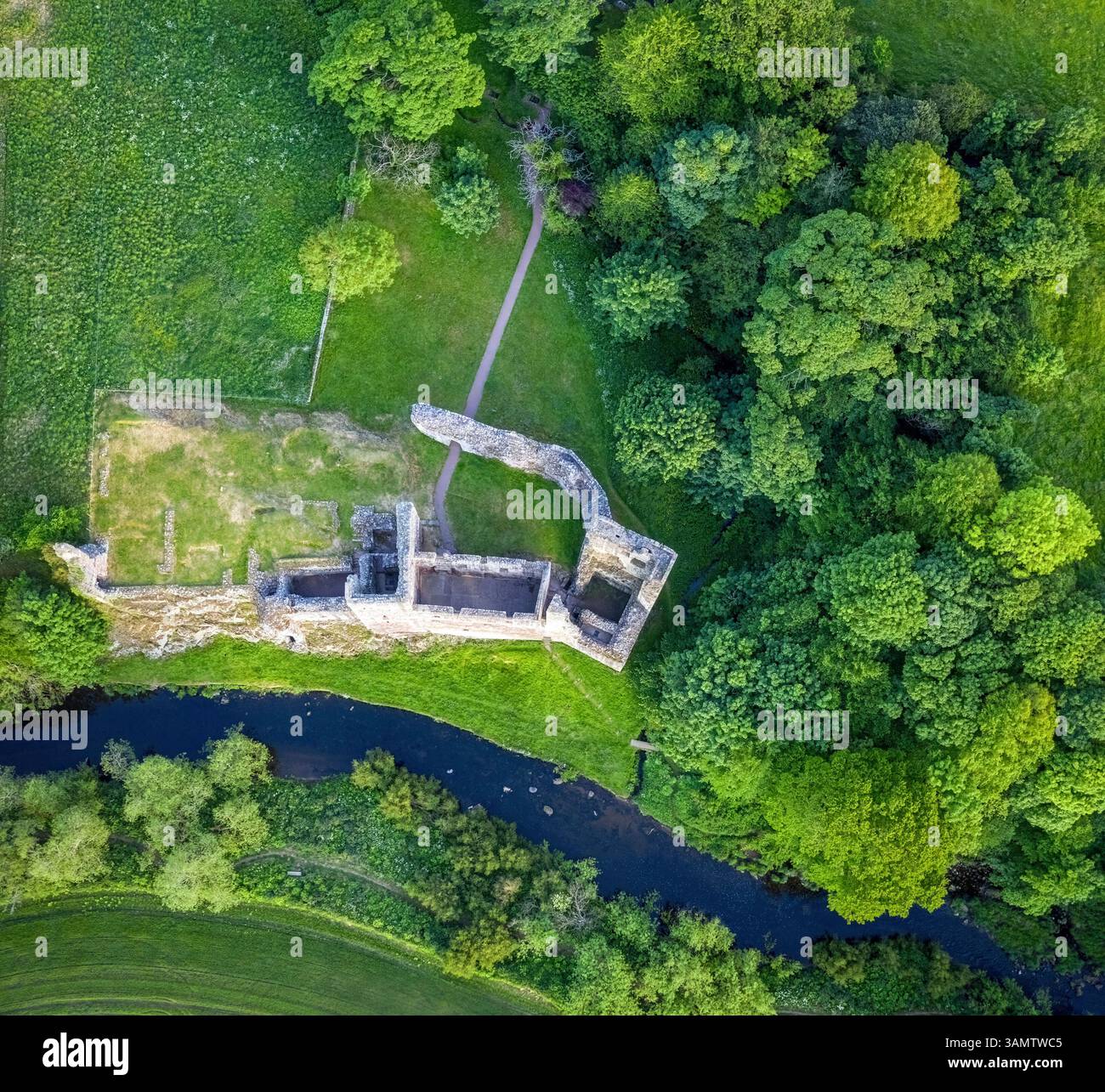 Aerial view of Hailes Castle surrounded by greenery and river ...