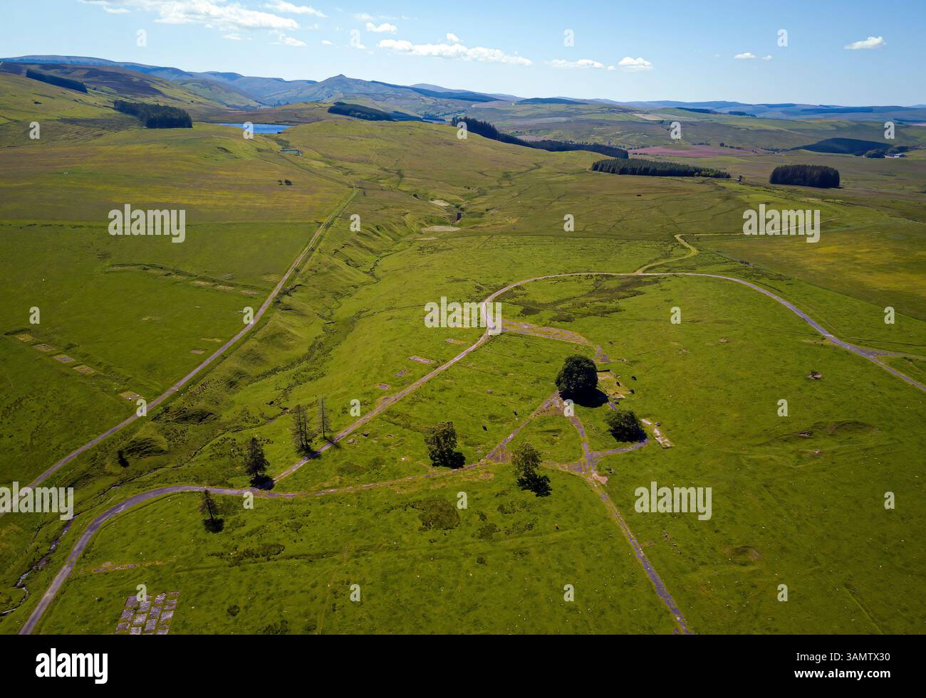 Aerial view of rolling hills and winding roads in Stobs Camp, Hawick ...