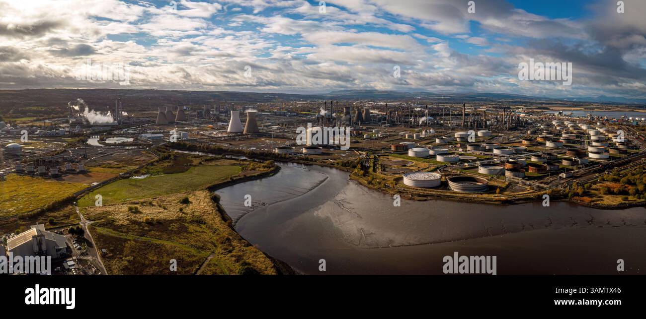 Aerial view of Grangemouth Oil Refinery with river and storage tanks ...
