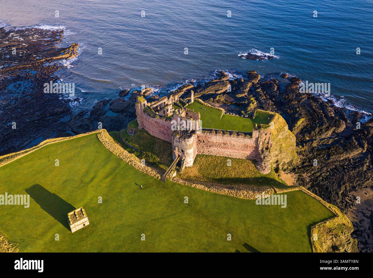 Aerial view of Tantallon Castle overlooking ocean and cliffs, North ...