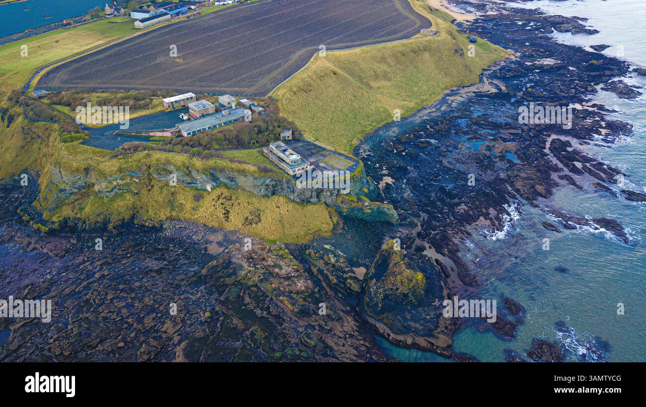 Aerial view of Gin Head cliffs and coastal buildings overlooking the ...