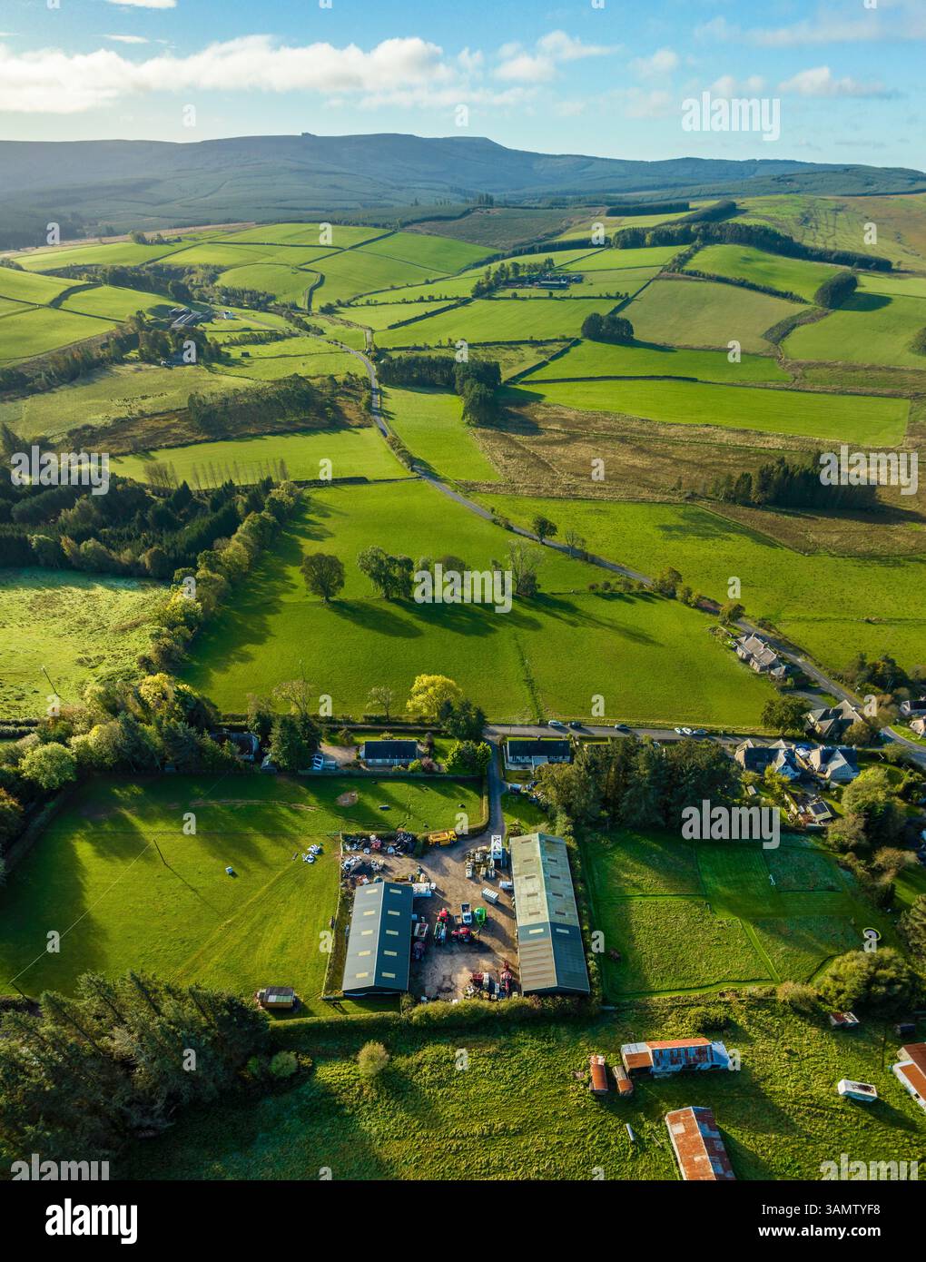 Aerial view of beautiful countryside with river, meadow, and trees ...