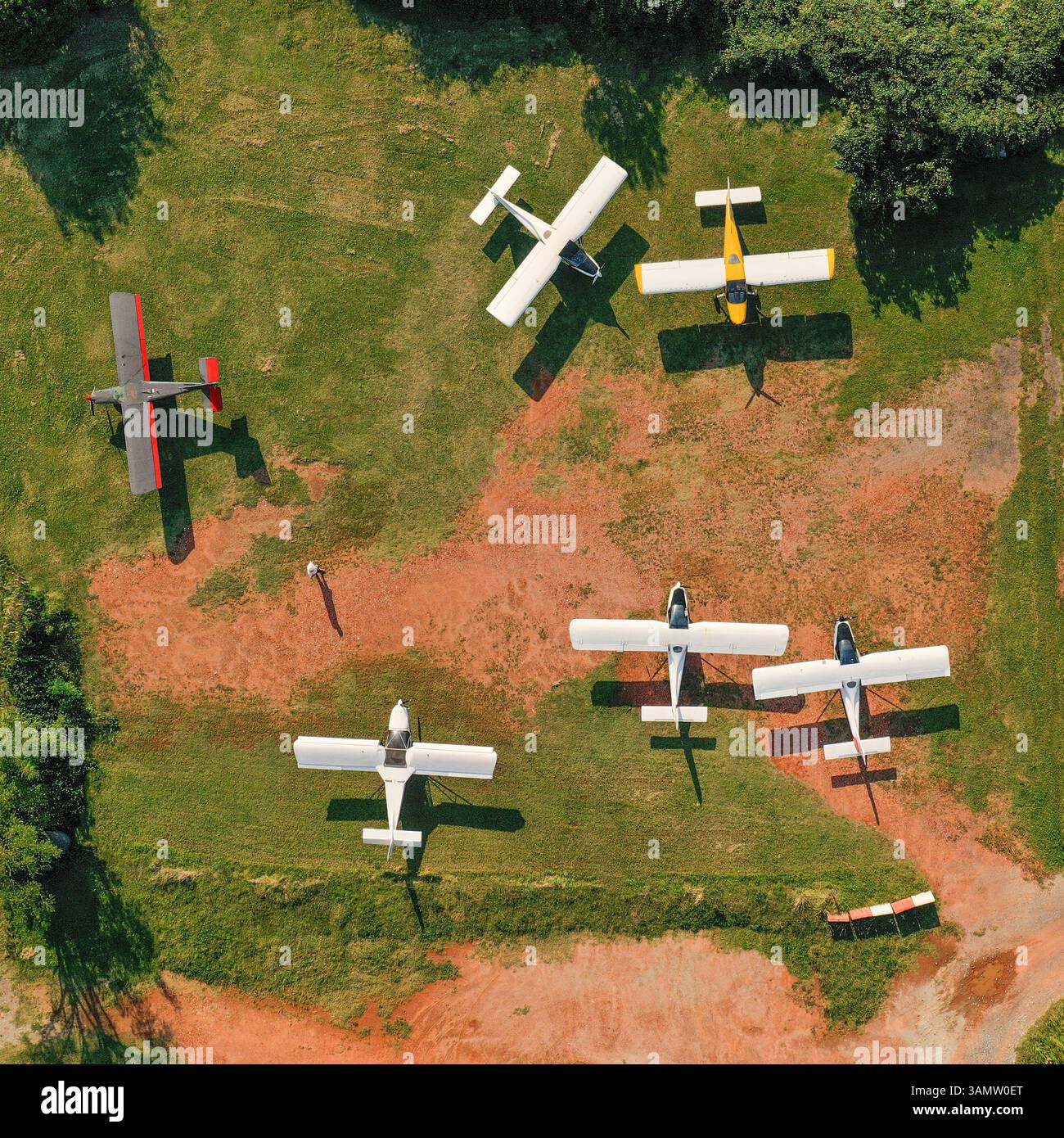 Aerial view of a bunch of ultralight airplanes parked in a private ...