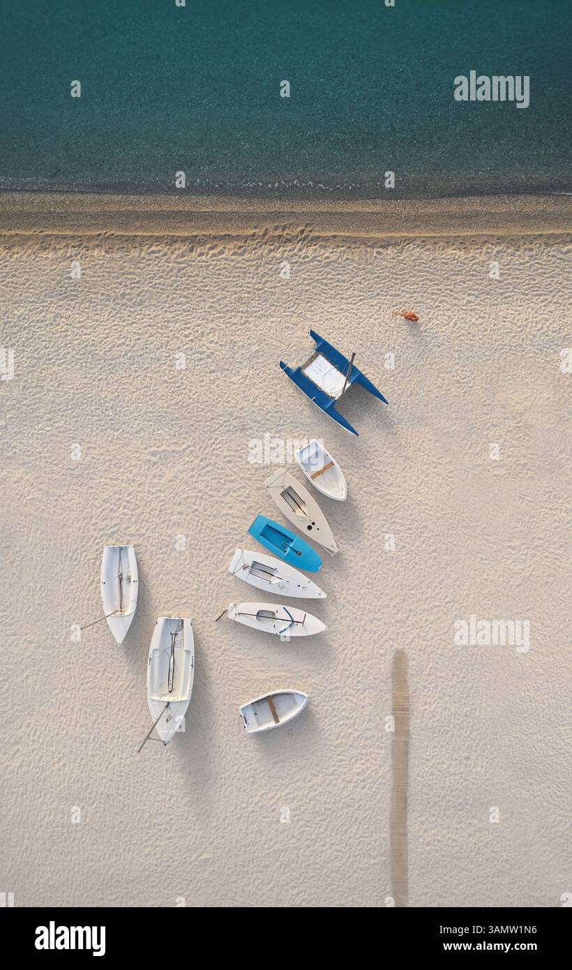 Aerial view of some boats of different shapes ashore in the early ...