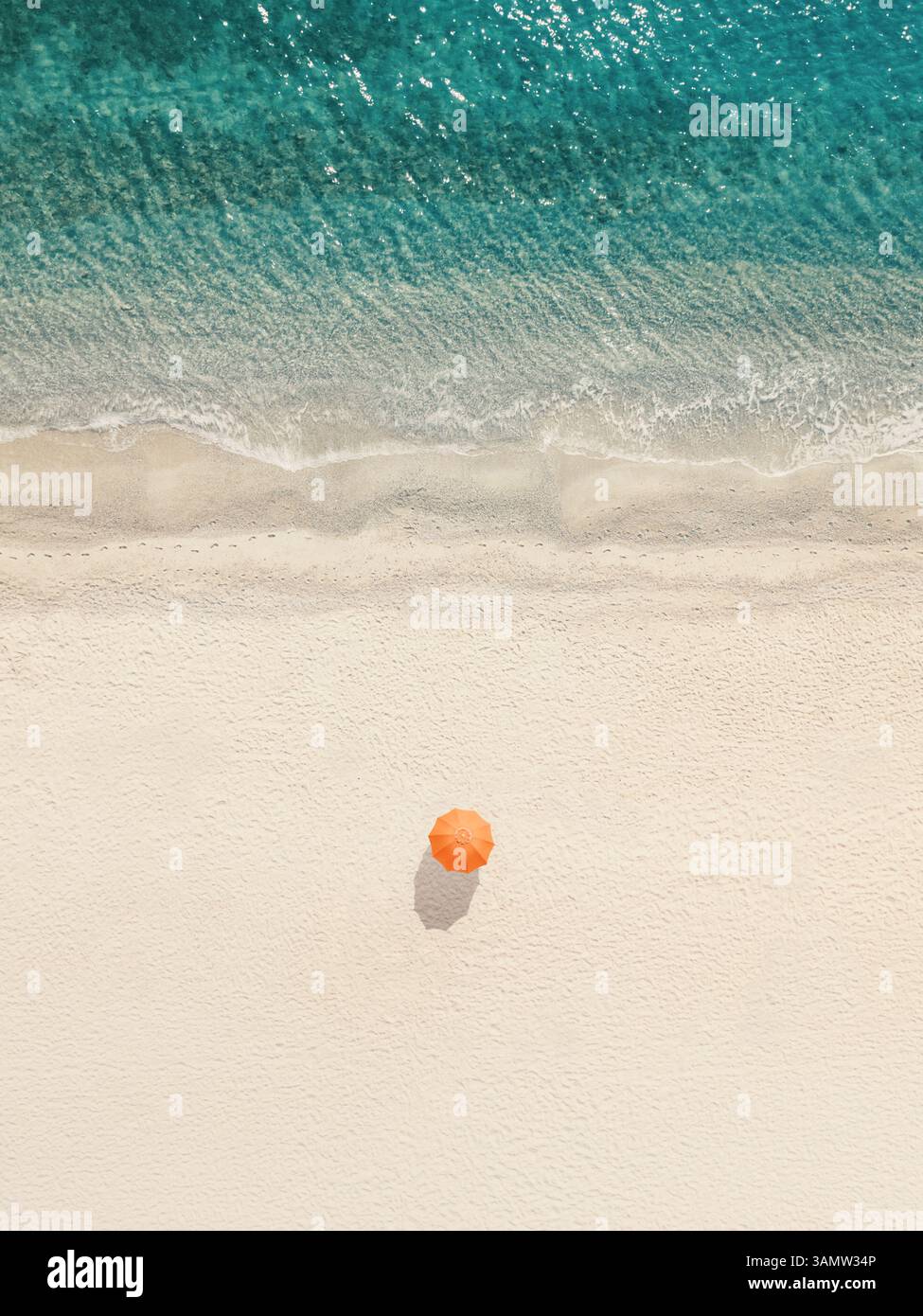 Aerial view of a lone orange parasol in a tranquil beach, Sant'Andrea ...