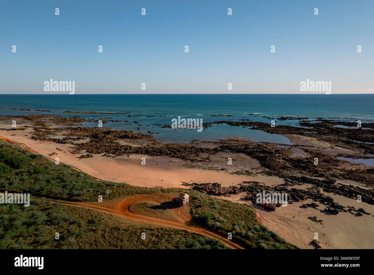 Aerial view of beautiful sandy beach and blue ocean at James Price ...