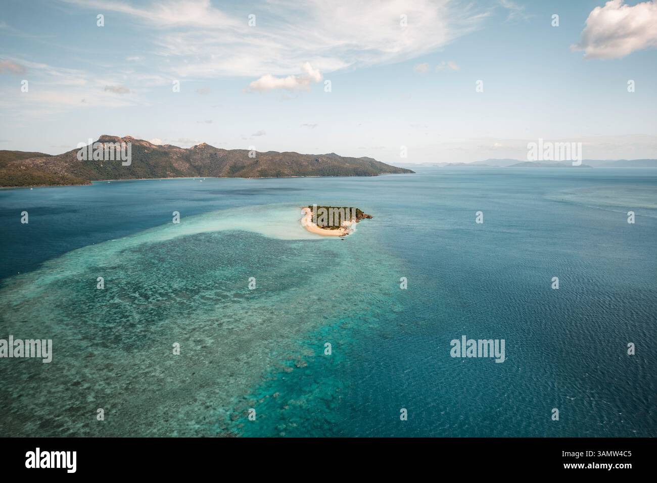 Aerial view of Black Island with the reef stretching far out and Hook ...