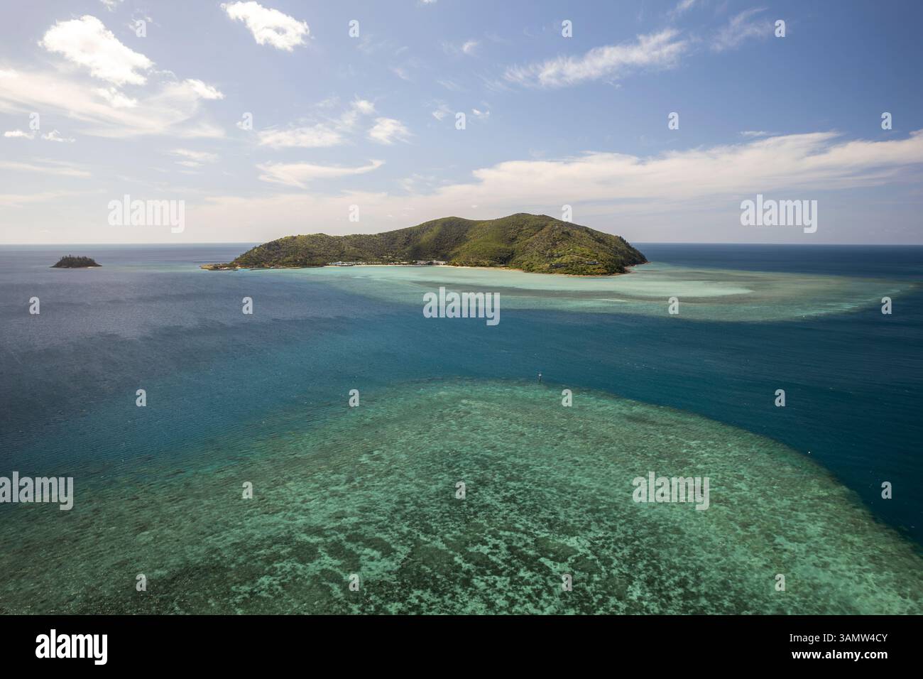 Aerial view of transparent turquoise waters surrounding Hayman Island ...