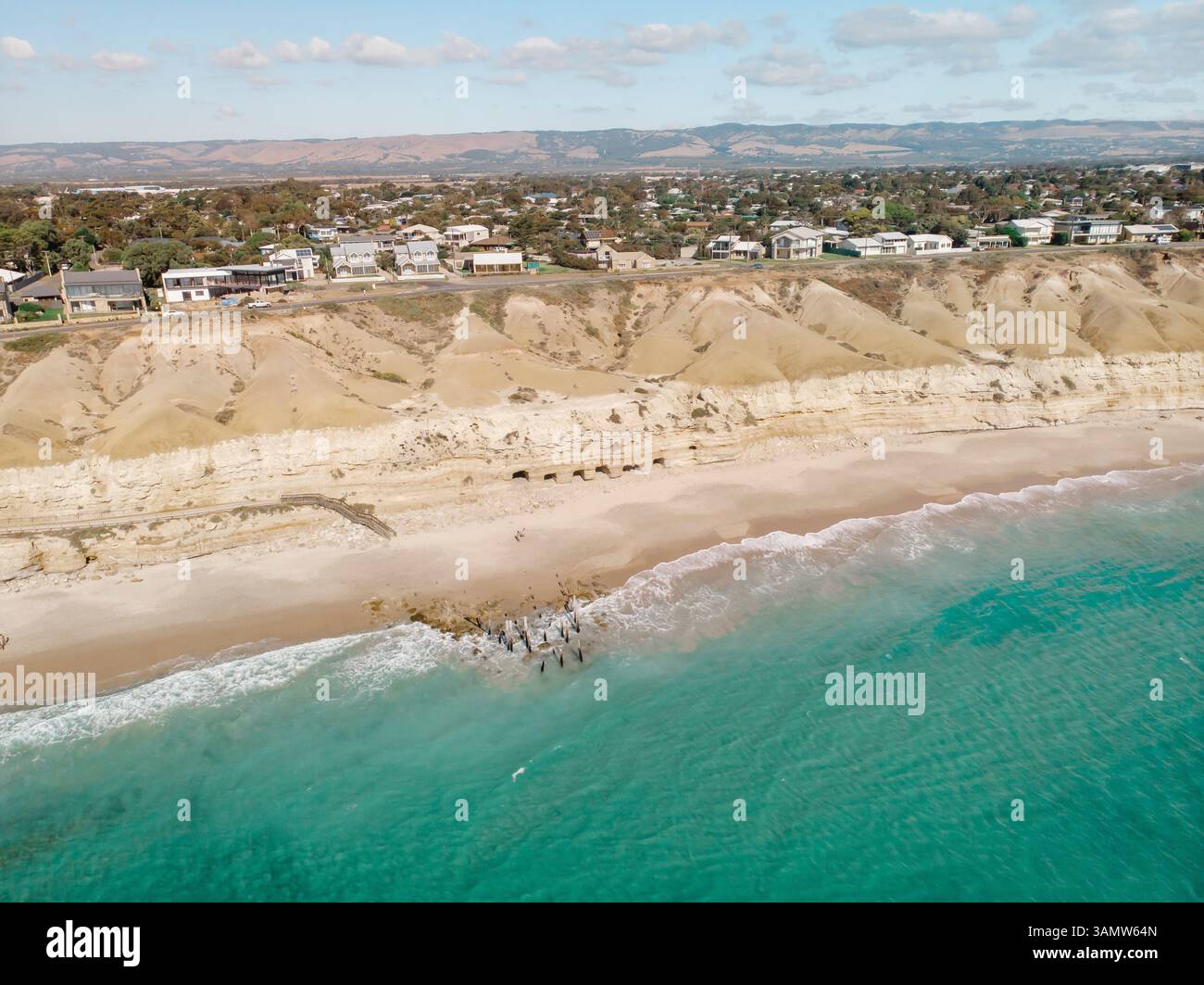 Aerial view of Port Willunga beach with caves in the cliff wall and ...