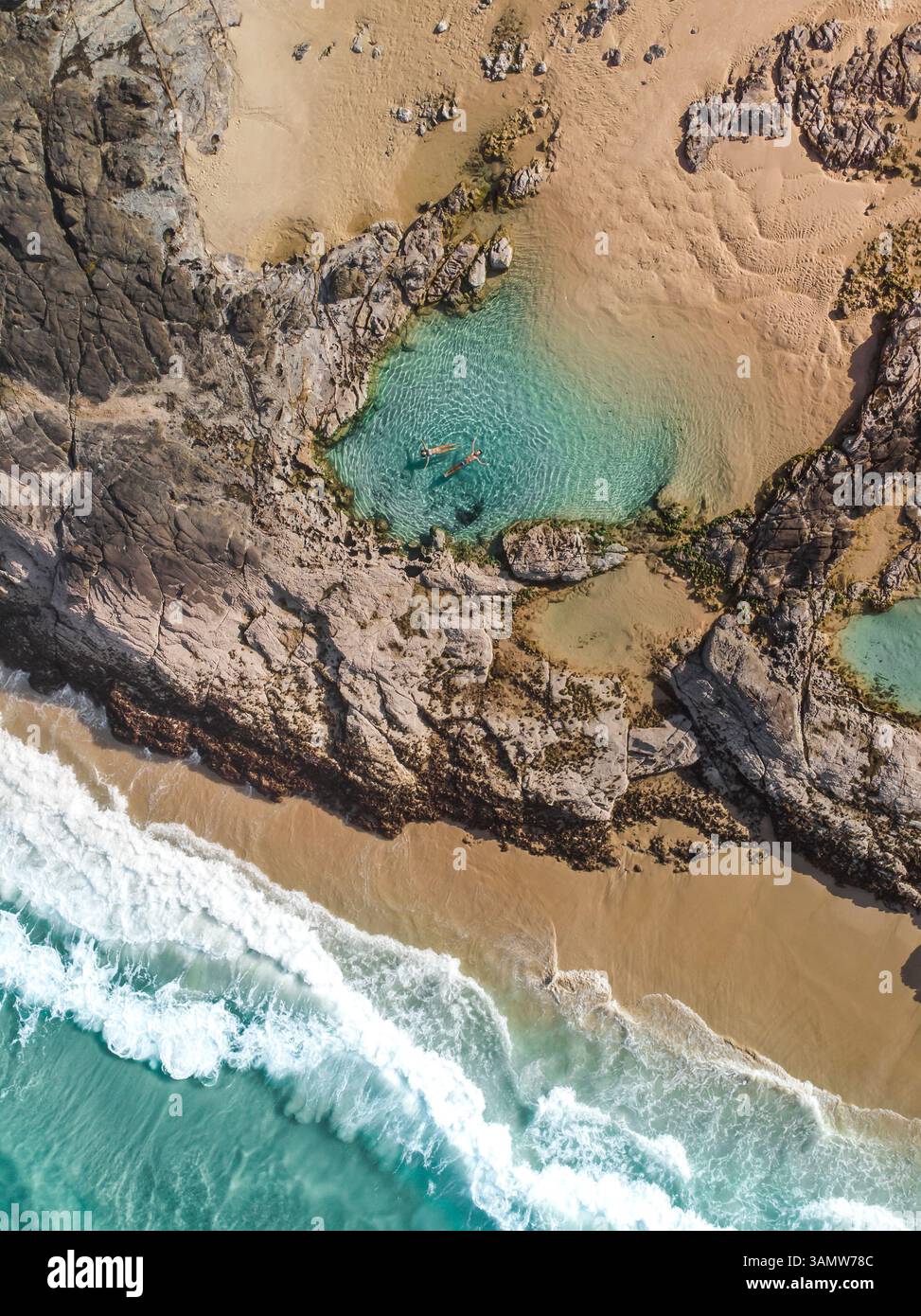 Aerial view of two people floating in the Champagne Pools, Fraser ...