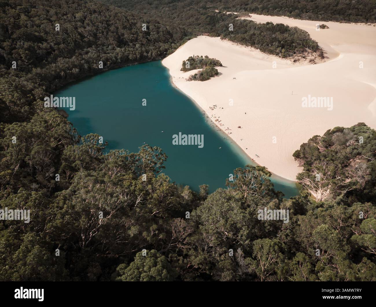 Aerial view of Lake Wabby with people sunbathing on a big sand dune ...