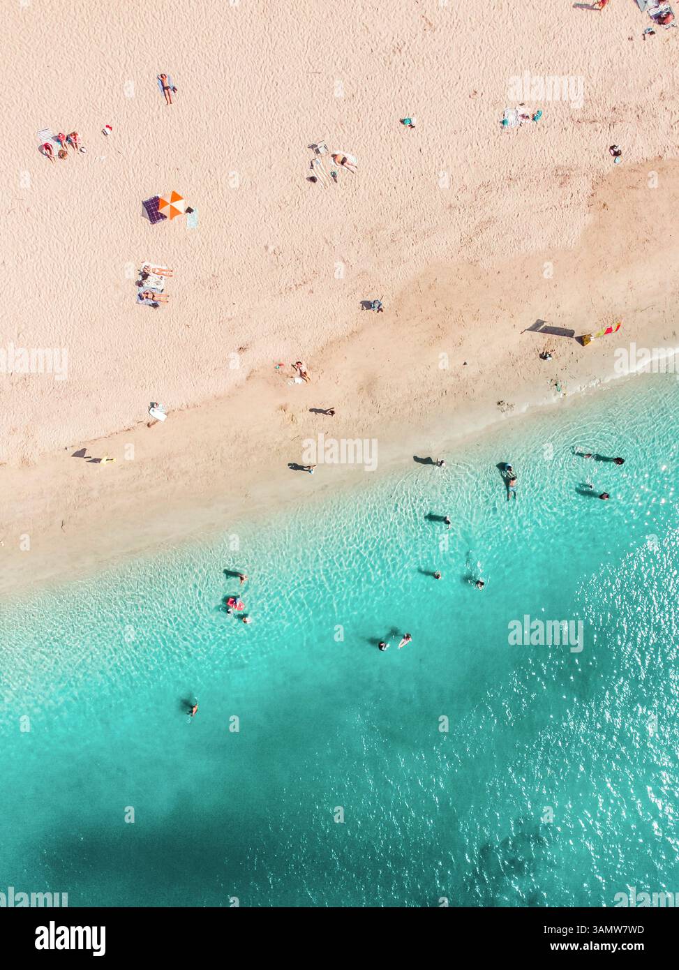 Aerial view of Tallebudgera Creek with a people swimming and sunbathing ...