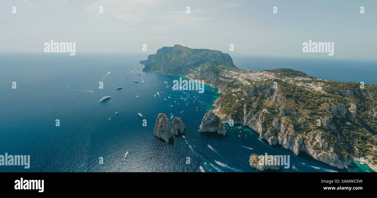Aerial view of boats sailing near the Capri's Faraglioni, Naples, Italy ...