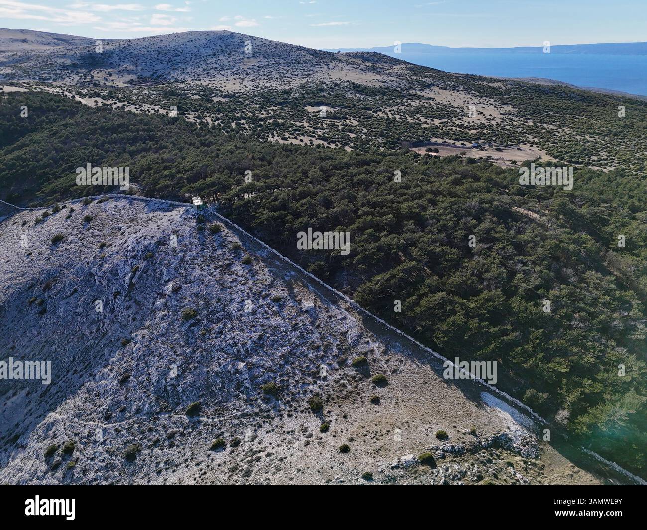 Aerial view of zip line station surrounded by scenic mountains and lush ...