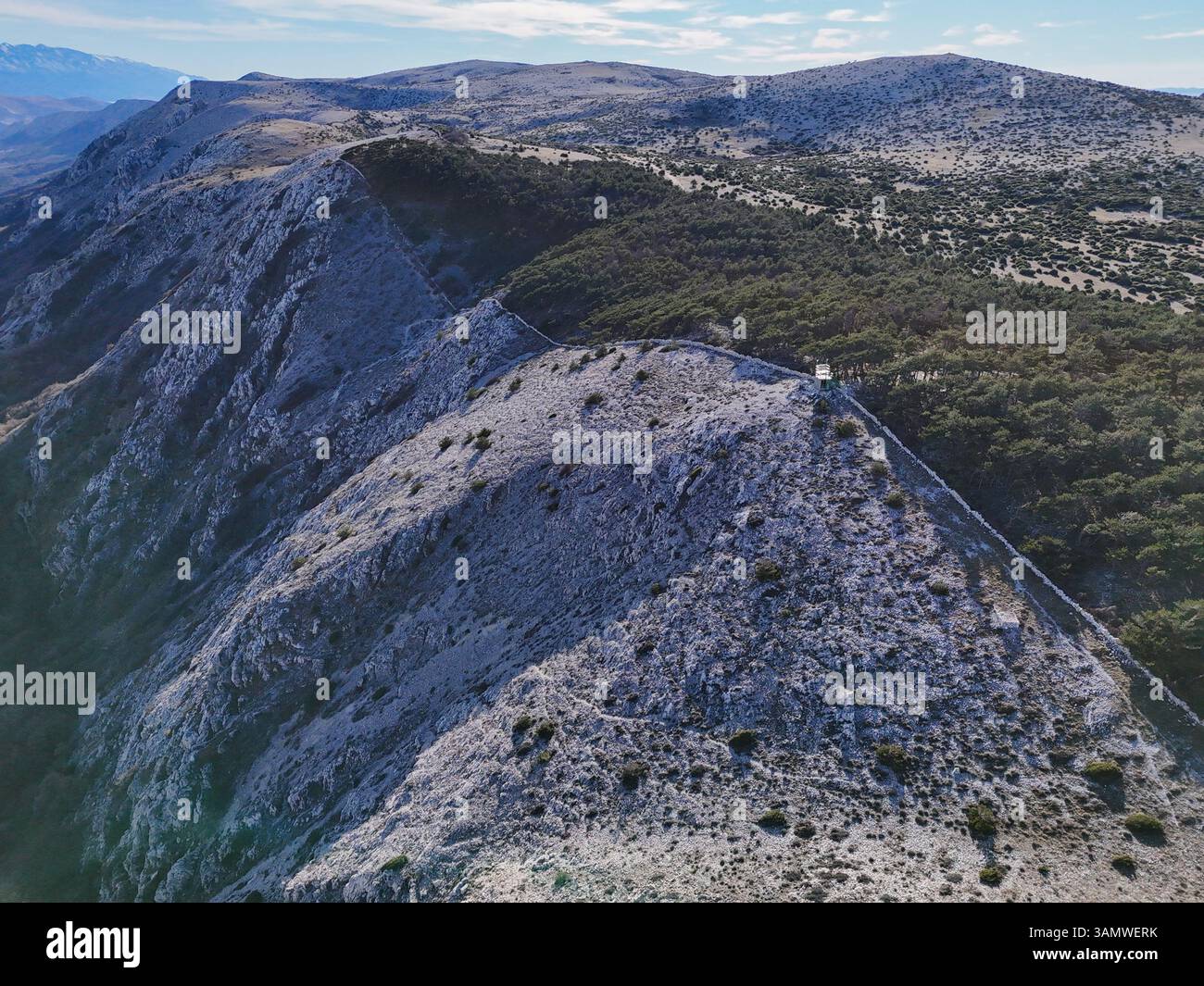 Aerial view of a breathtaking zip line station on a rugged mountain ...