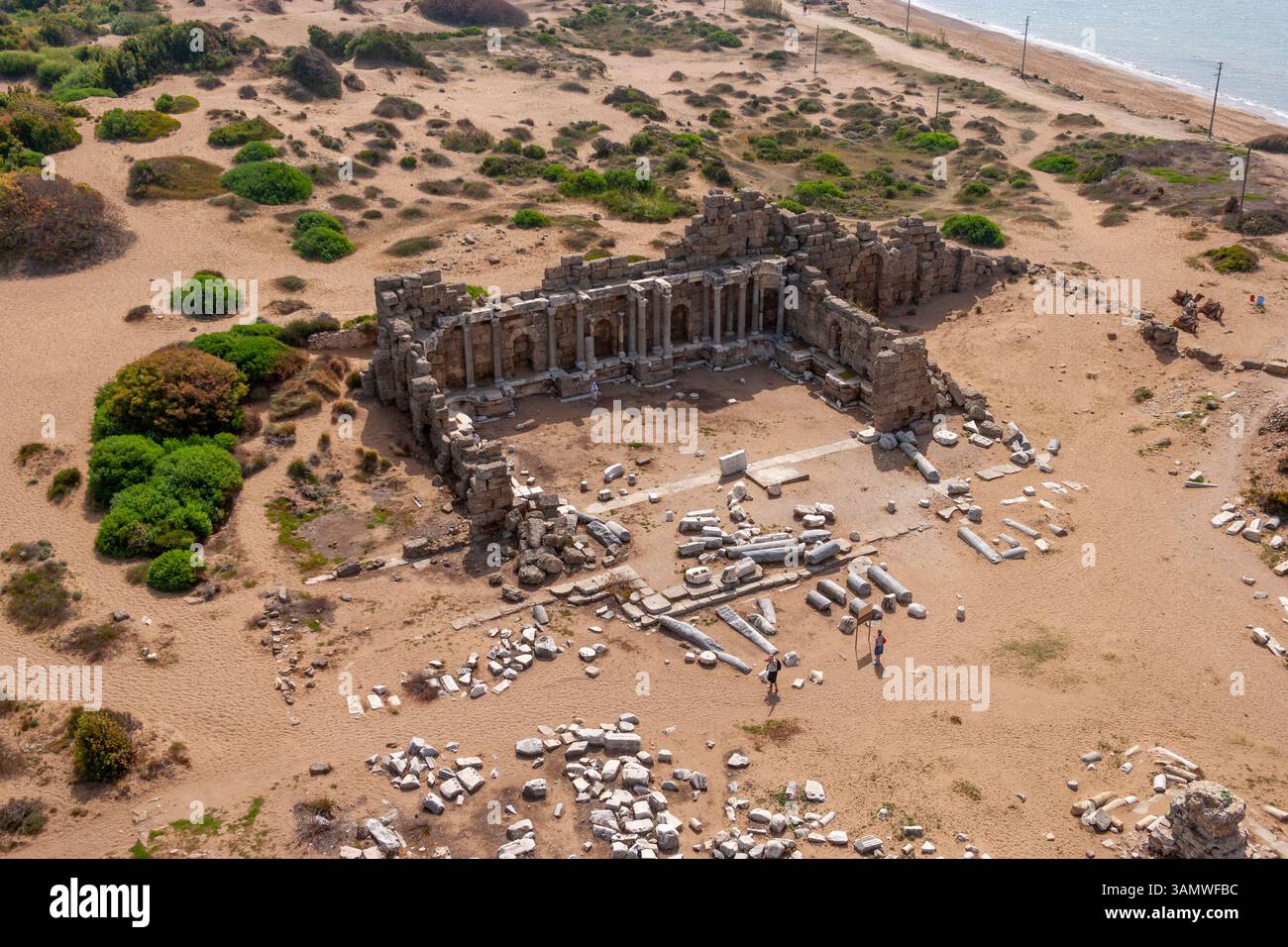 Aerial view of ancient ruins and sandy beach in a coastal landscape ...