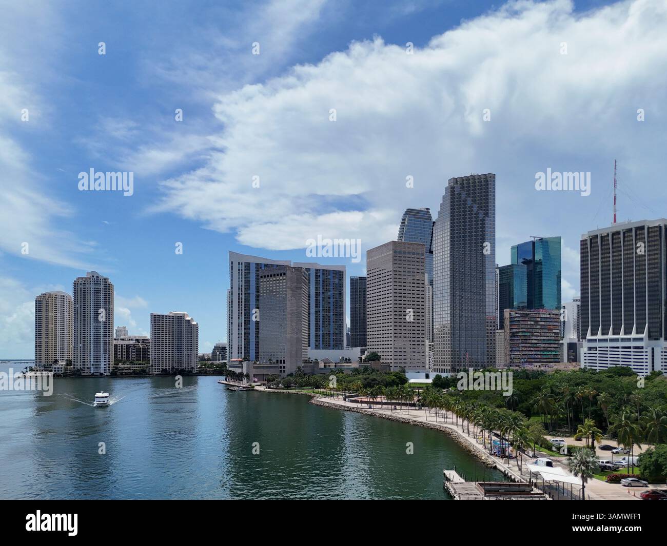 Aerial view of beautiful modern skyscrapers and scenic waterfront under ...