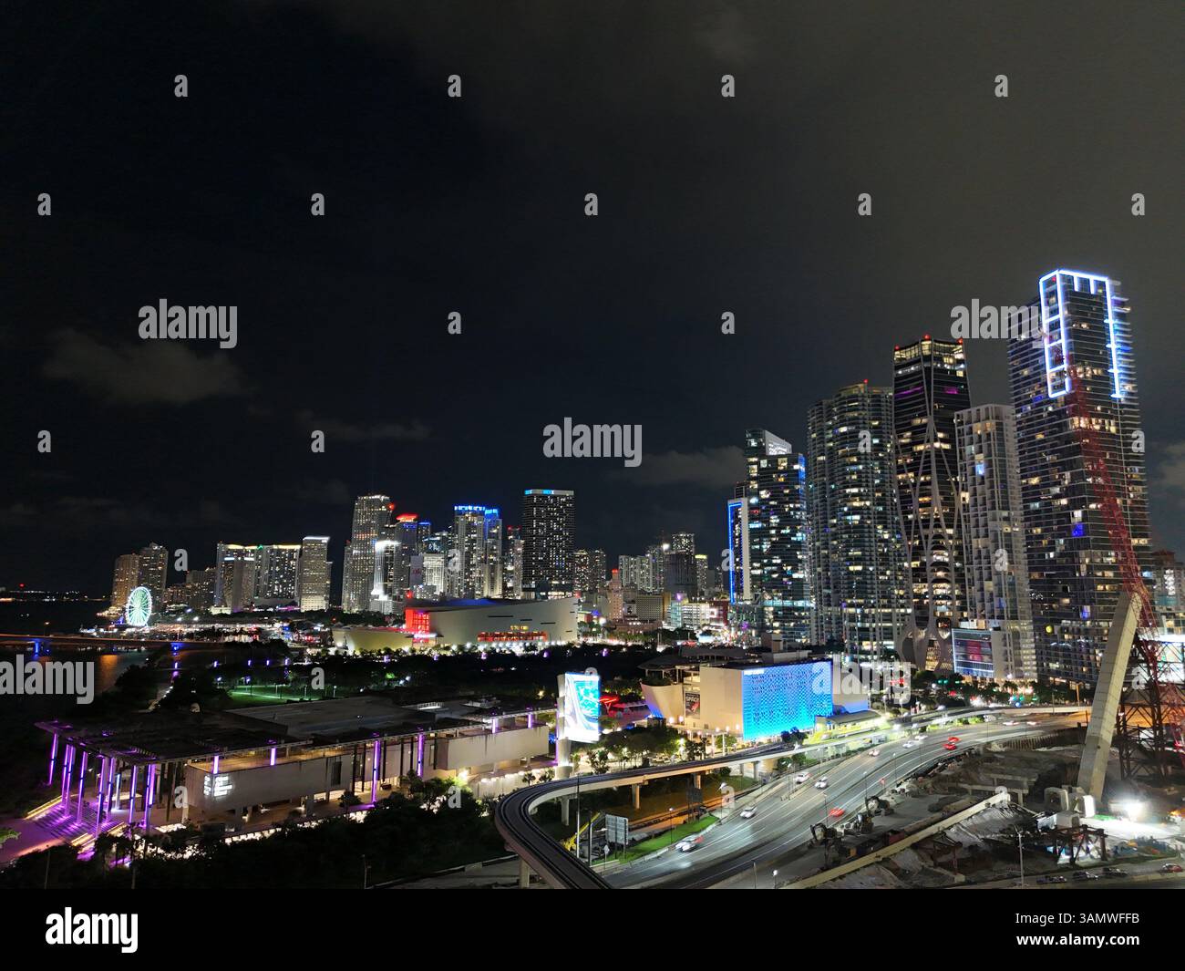 Aerial view of illuminated skyline with bustling skyscrapers and ...