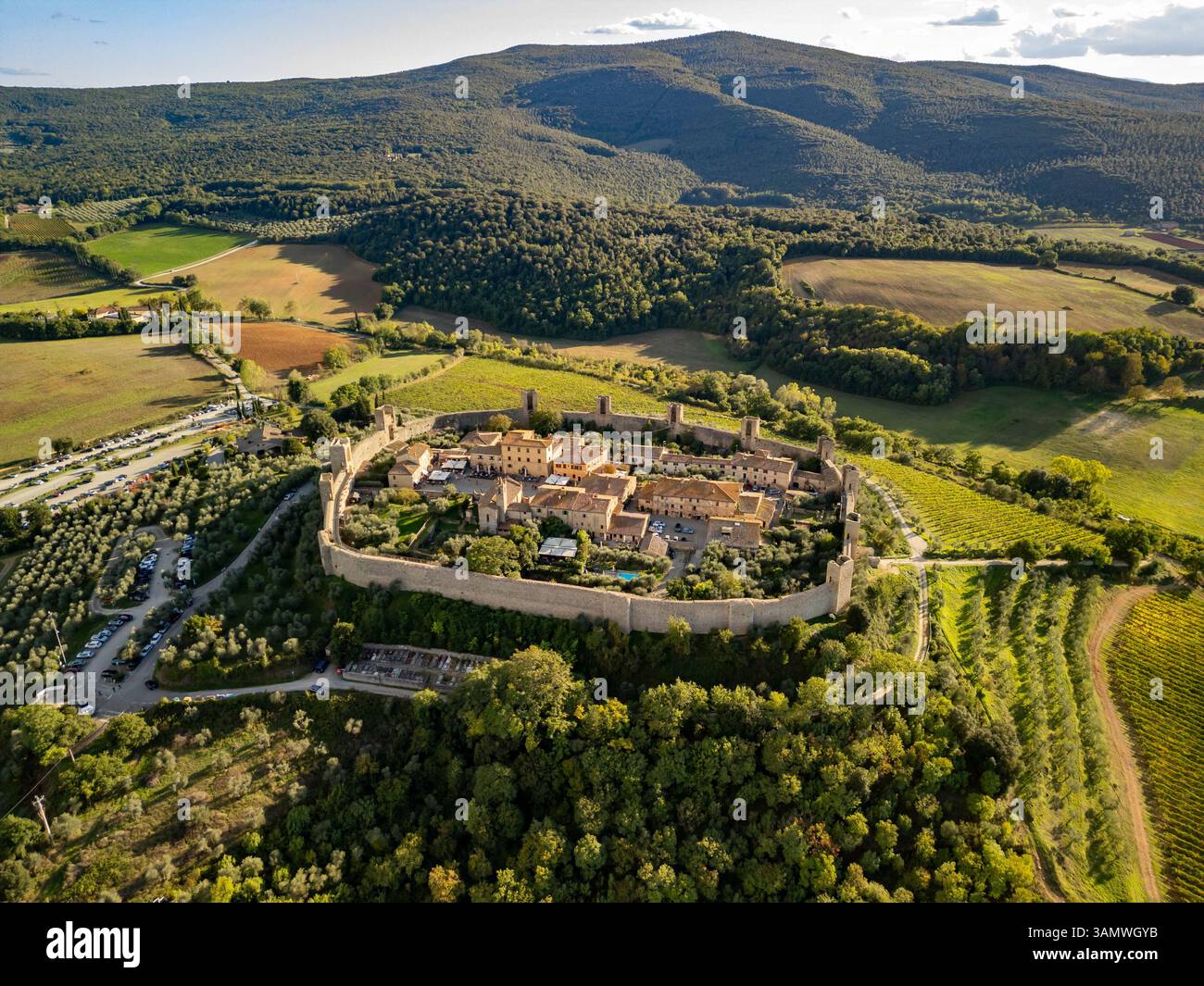 Aerial view of medieval walled town surrounded by beautiful countryside ...