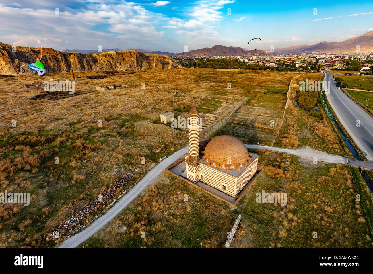 Aerial view of Castle of Van, Kaya Celebi Mosque, paramotors and ruins ...