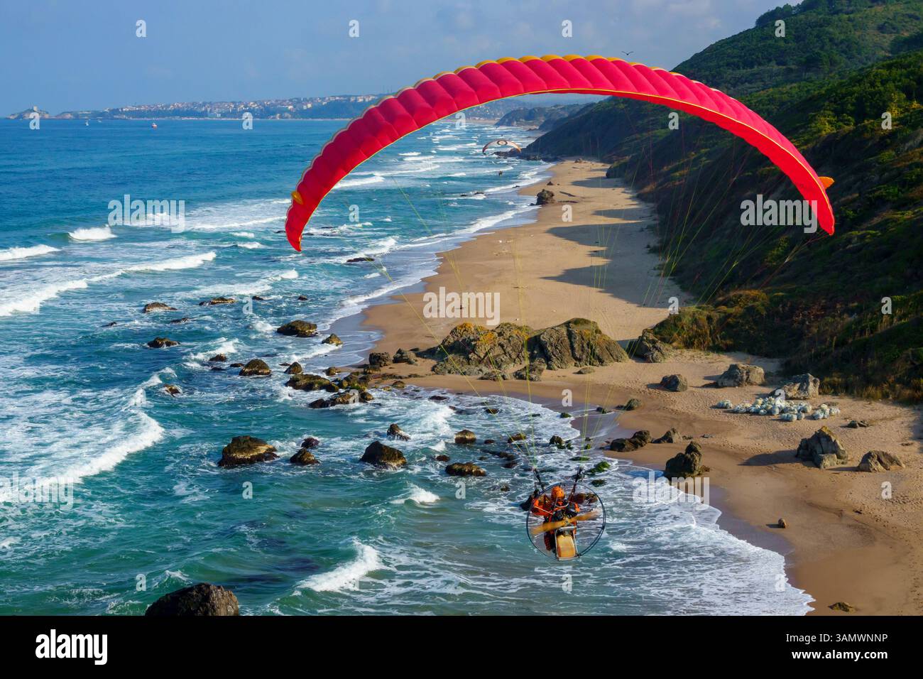Aerial view of paramotor pilots flying along the Black Sea coast in Sile, Istanbul, Turkey Stock ...