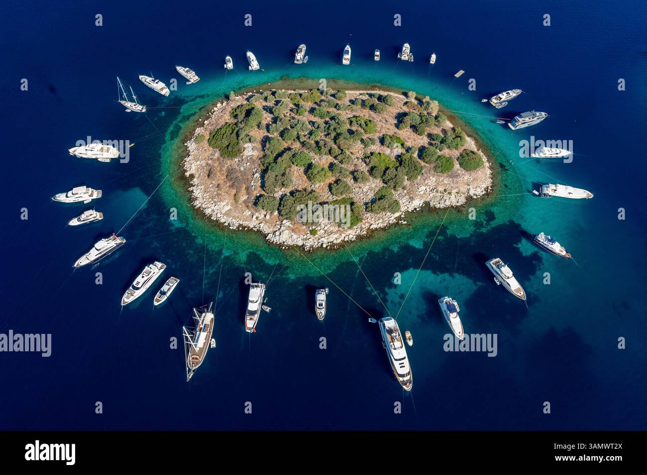 Aerial view of anchored boats around an island in Turkbuku, Bodrum ...