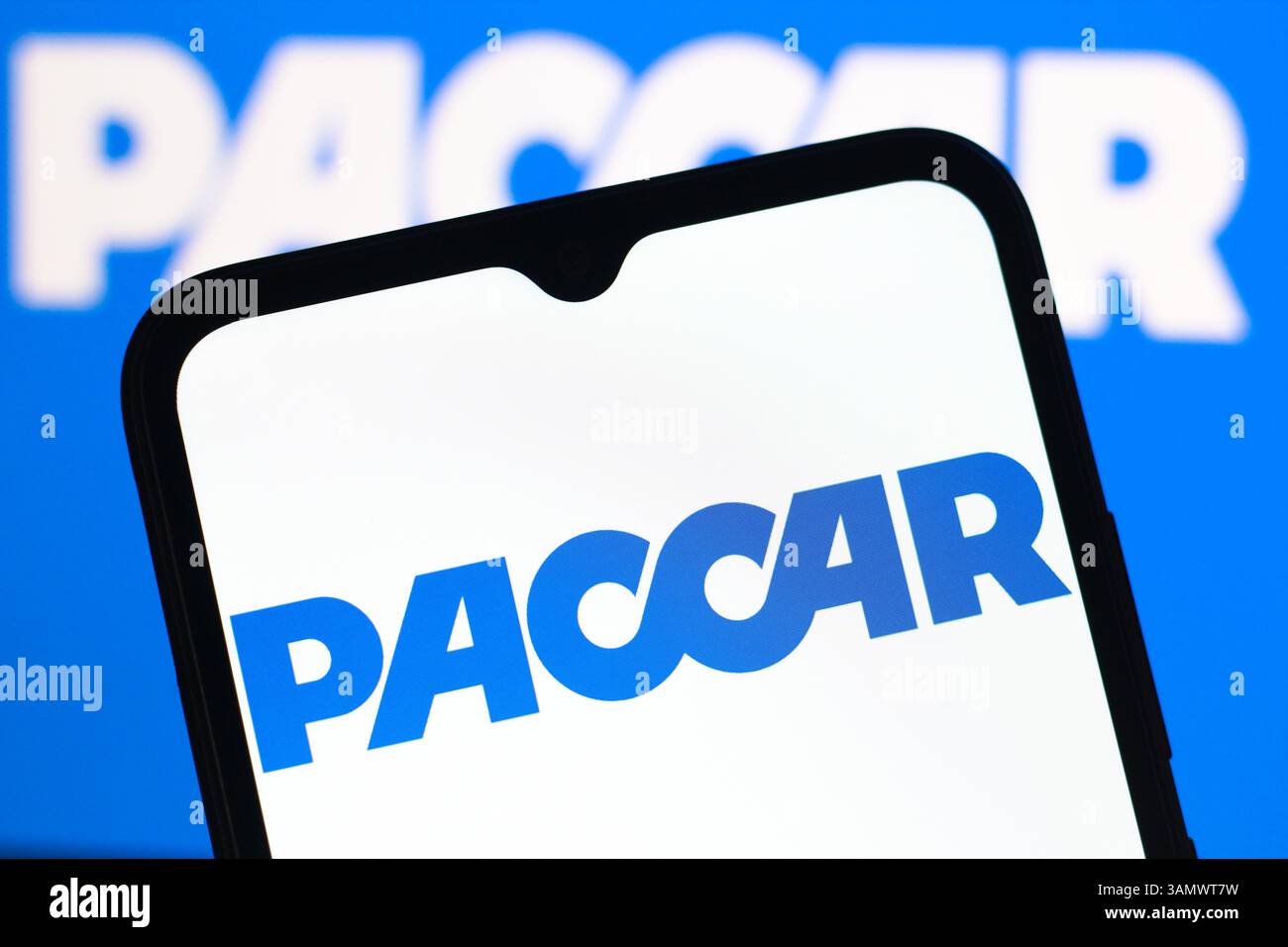 In this photo illustration, the Paccar logo is seen displayed on a ...