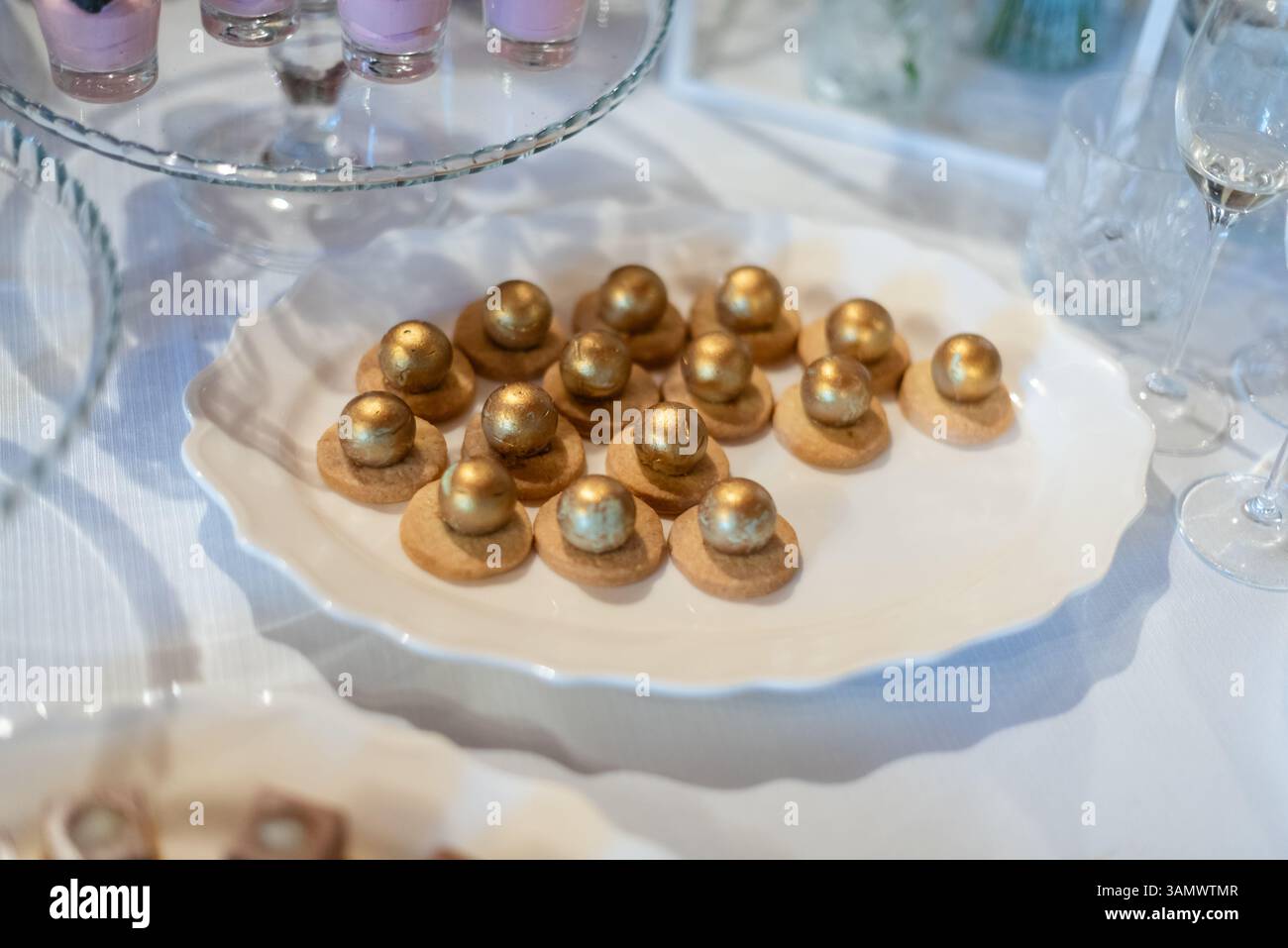 A plate displays beautiful golden desserts, presenting a refined touch ...
