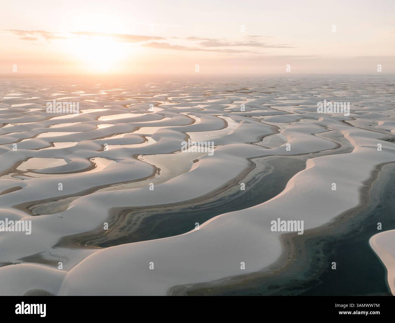 Aerial view of empty sand dunes and lagoons at Lencois Maranhenses ...