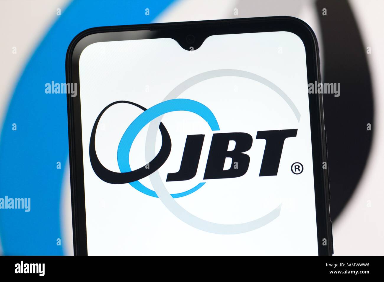 In this photo illustration, the JBT Corporation logo is seen displayed ...