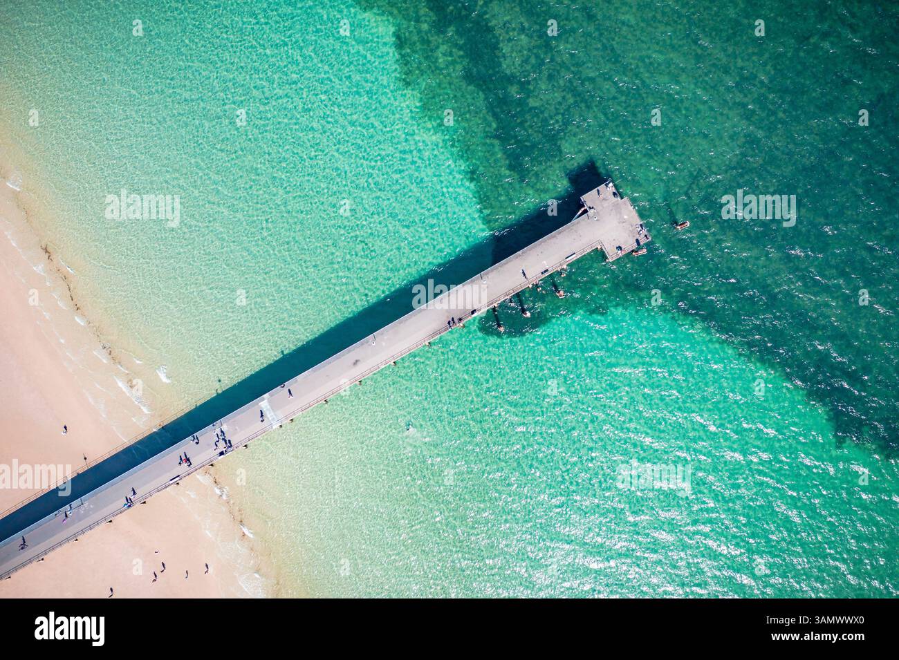 Aerial View Of Jetty Over Turquoise Ocean Water And Coral Reef At ...
