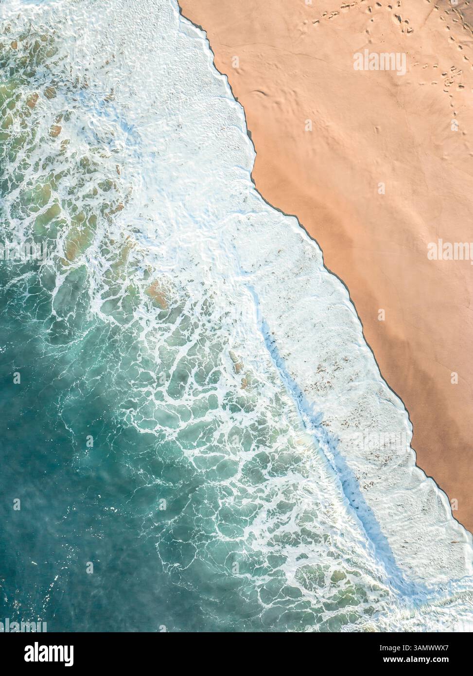 Aerial Top Down View Of Blue Ocean Waves Breaking Onto Sand At Bronte ...