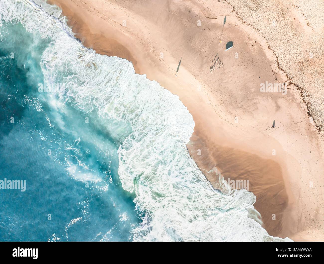 Aerial Top Down View Of Blue Ocean Waves Breaking Onto Sand At Bronte ...