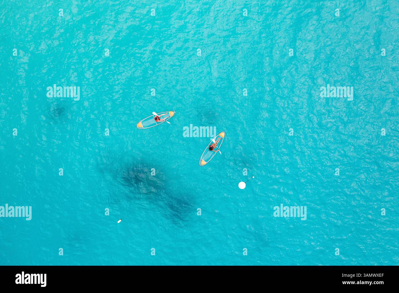 Aerial Top Down View Of Two People Kayaking in Clear Blue Ocean Water ...